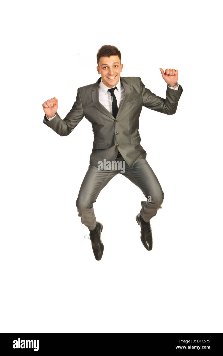 Successful happy business man leaping isolated on white background ...
