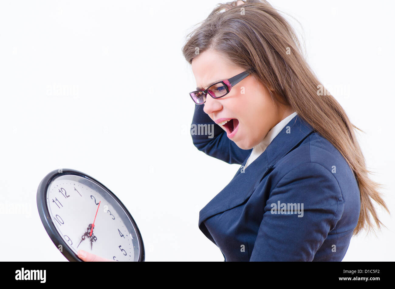 A woman running and holding a clock Stock Photo - Alamy