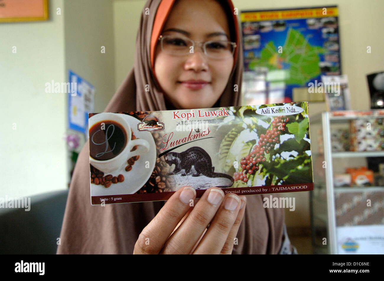 Owner Luwakmas coffee industry Hj Yekti Murih Wiyati displays a package ...
