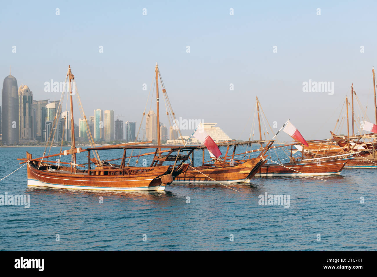 Traditional sailing dhows lined up in Doha Bay, Qatar, to mark Qatar's ...