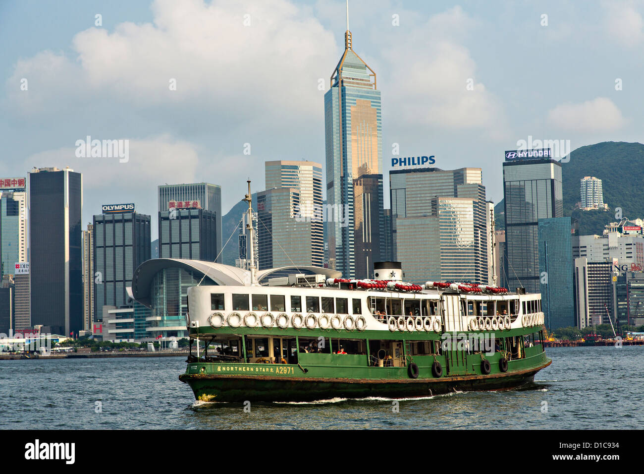 Star Ferry crossing Victoria Harbour with Central District in the ...