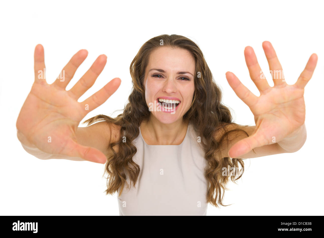 Pretty young woman pulling hands in camera Stock Photo - Alamy