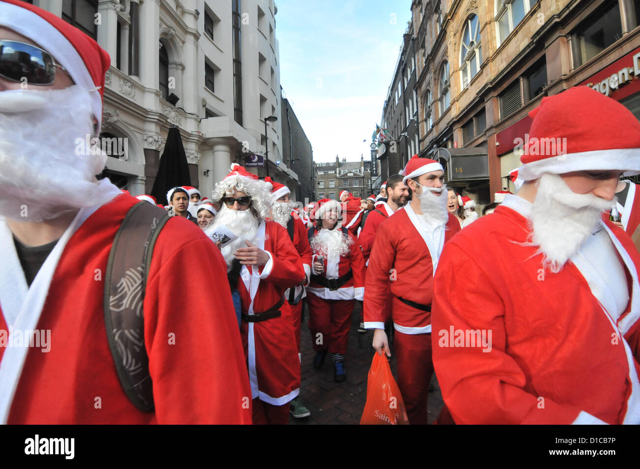Leicester Square, London, UK. 15th December 2012. Santas outside the ...