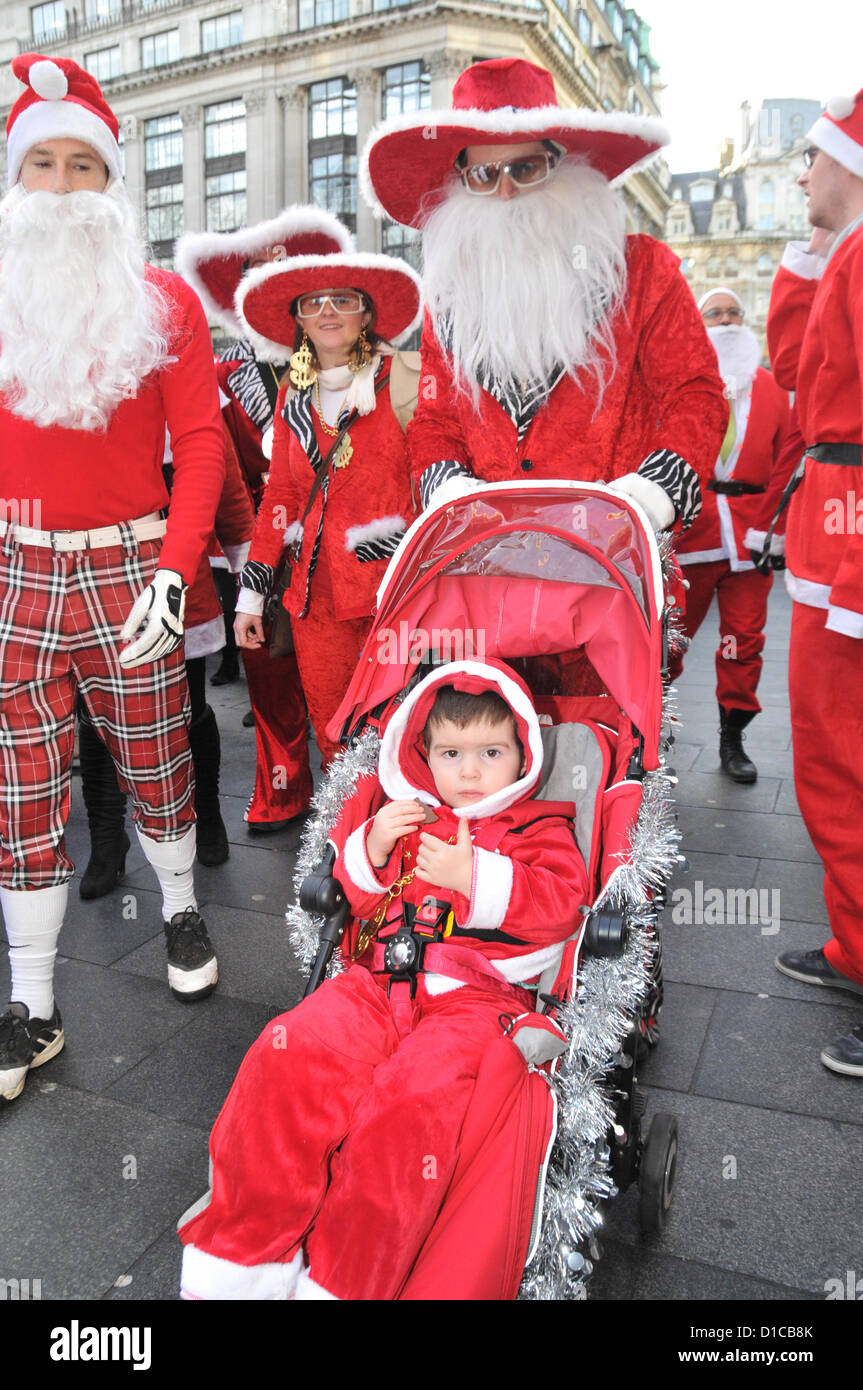 Leicester Square, London, UK. 15th December 2012. A Santa Father and a ...