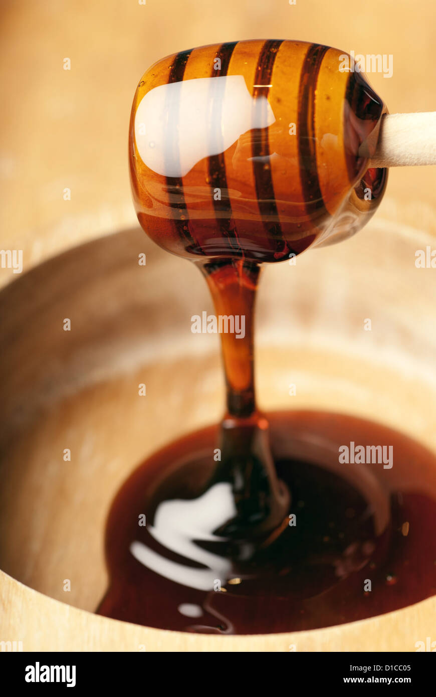 Big honey spill showing translucent syrup on wood Stock Photo - Alamy