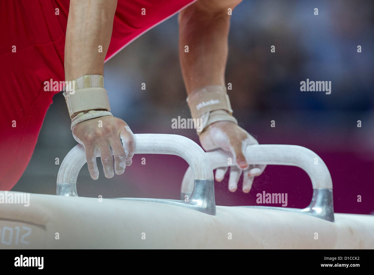 Detail of male gymnast's hands on the pommel horse during the Men's ...