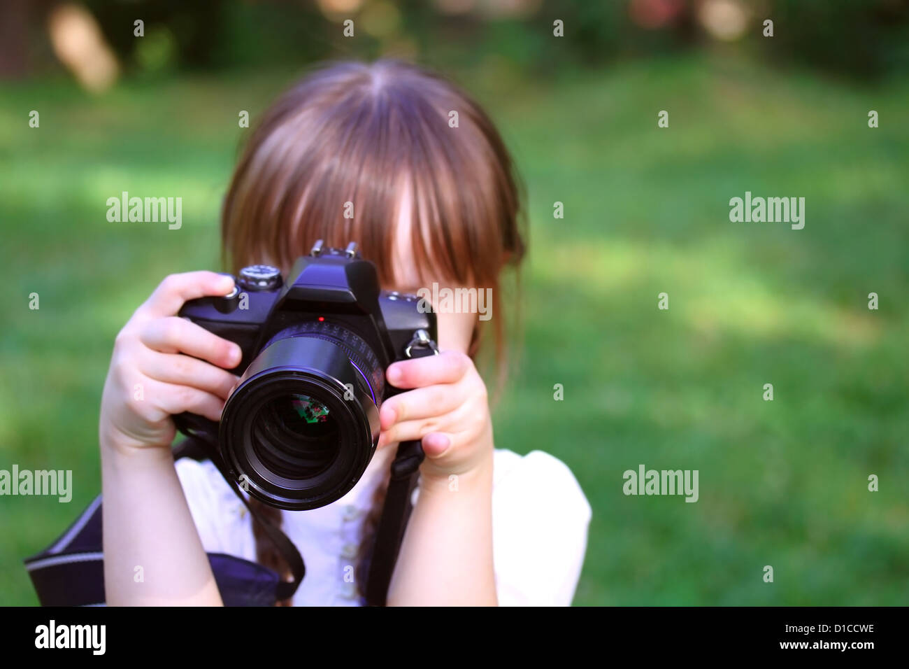 Girl taking pictures Stock Photo - Alamy