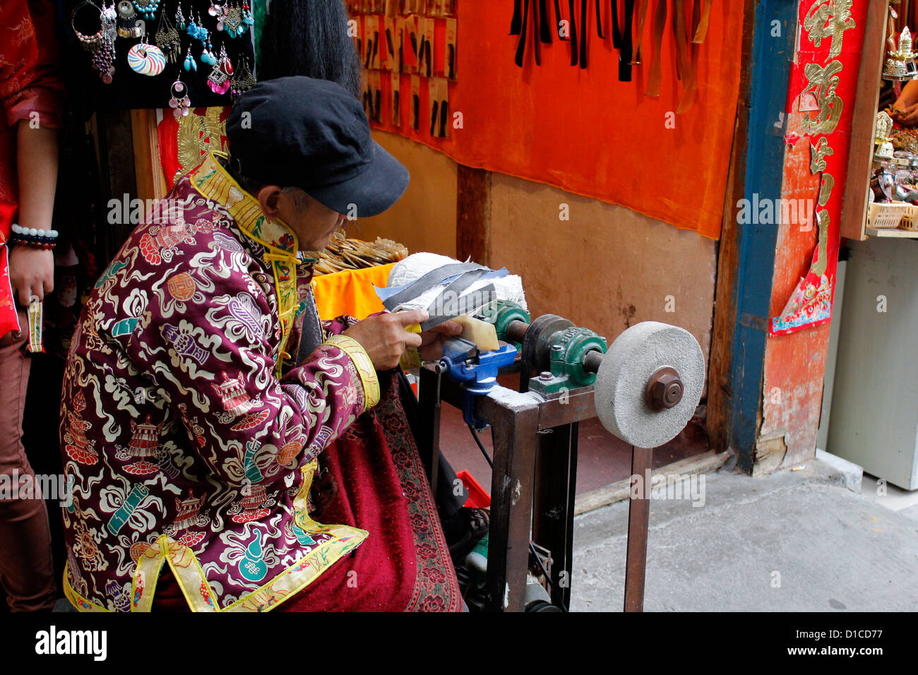 A Chinese making combs from animal horns in Shuzheng Village at the ...