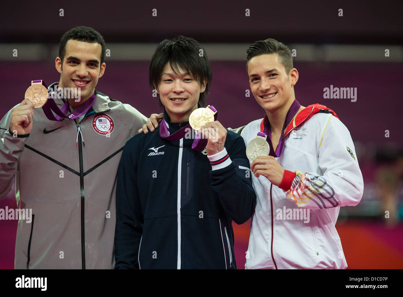 Kohei Uchimura (JPN) gold medlist center with silver medalist Marcel ...