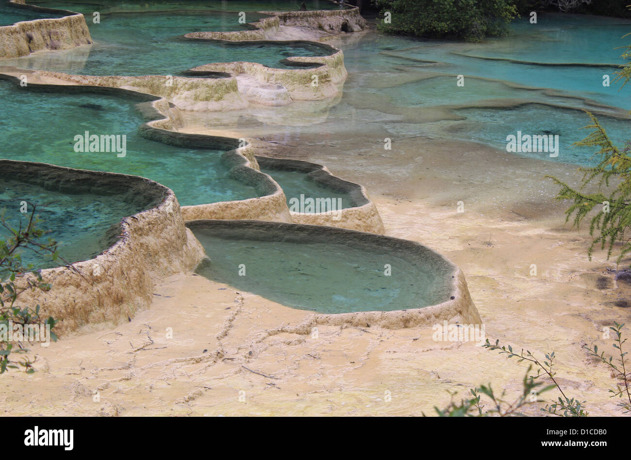 Pools formed by calcite deposits in Huanglong nature reserve literally ...