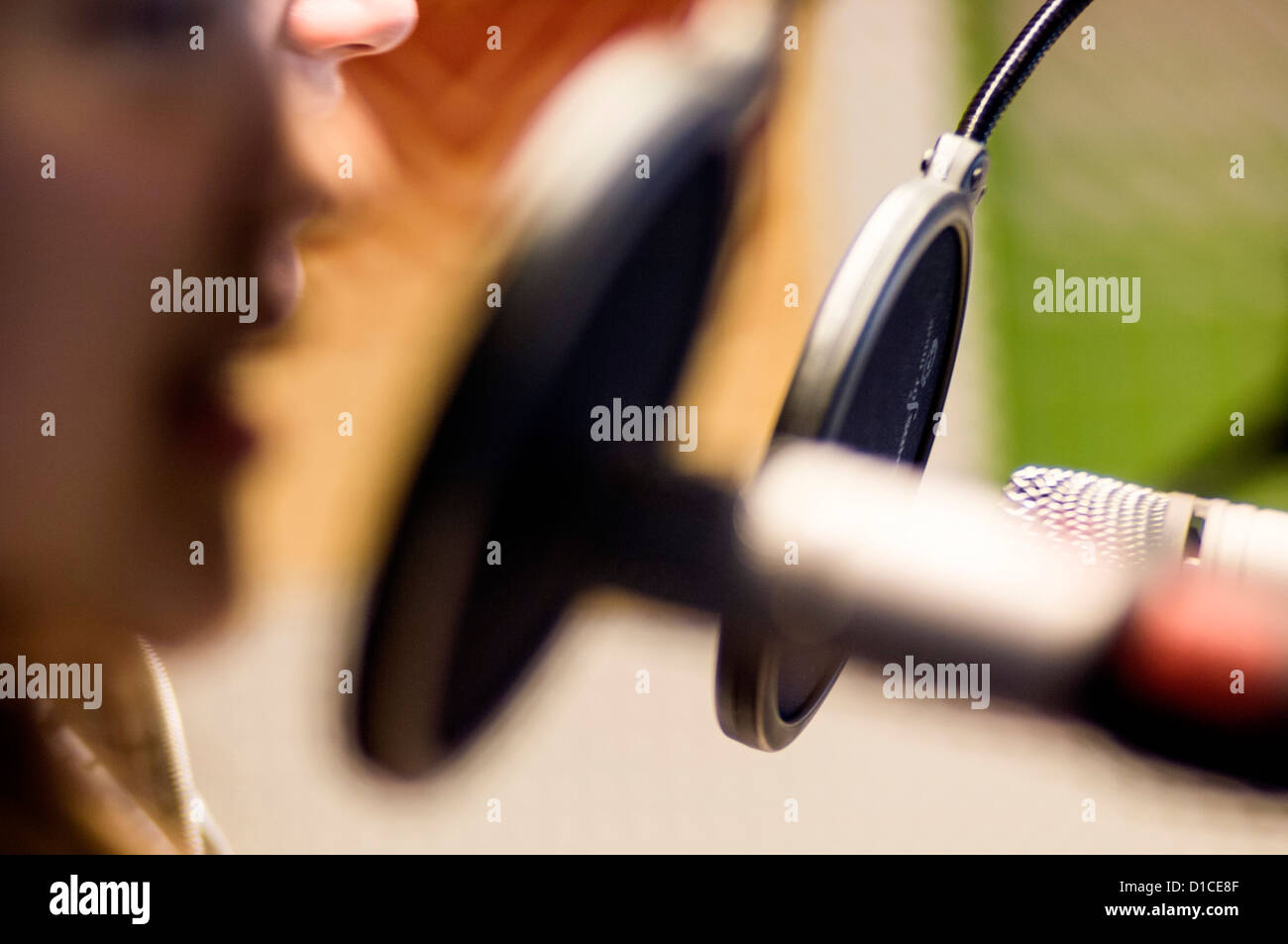 Two singers at microphones Stock Photo - Alamy