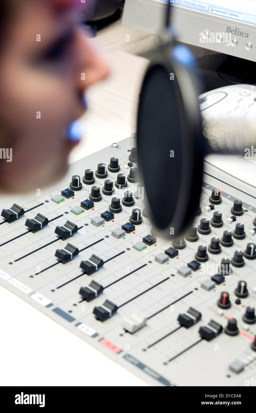 Radio speaker with mixer console Stock Photo - Alamy