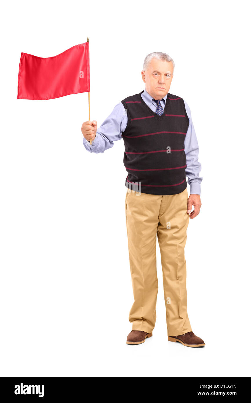 Full length portrait of a sad senior man waving a red flag isolated on ...
