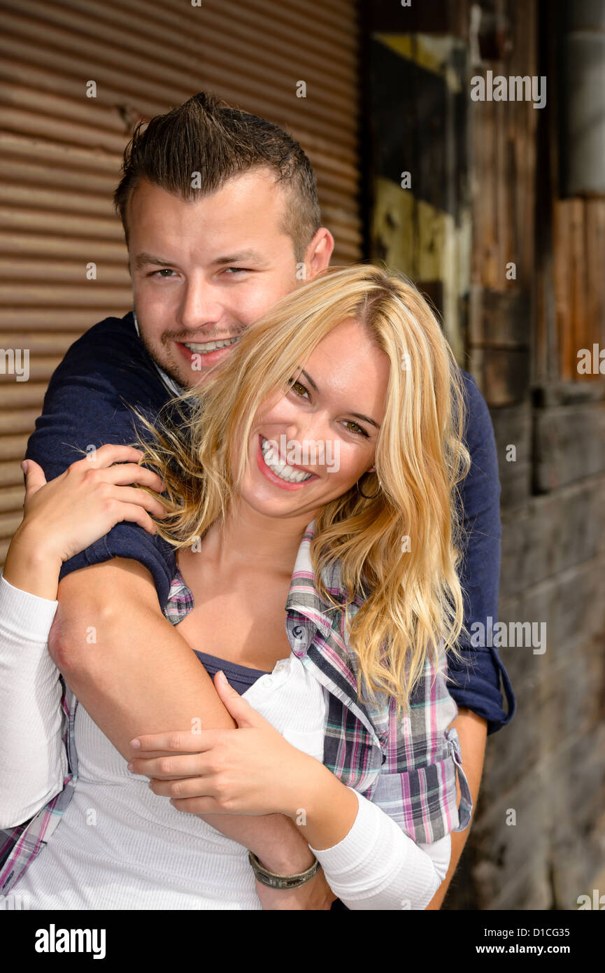 Man embracing woman and smiling relaxing excited love vacation couple ...