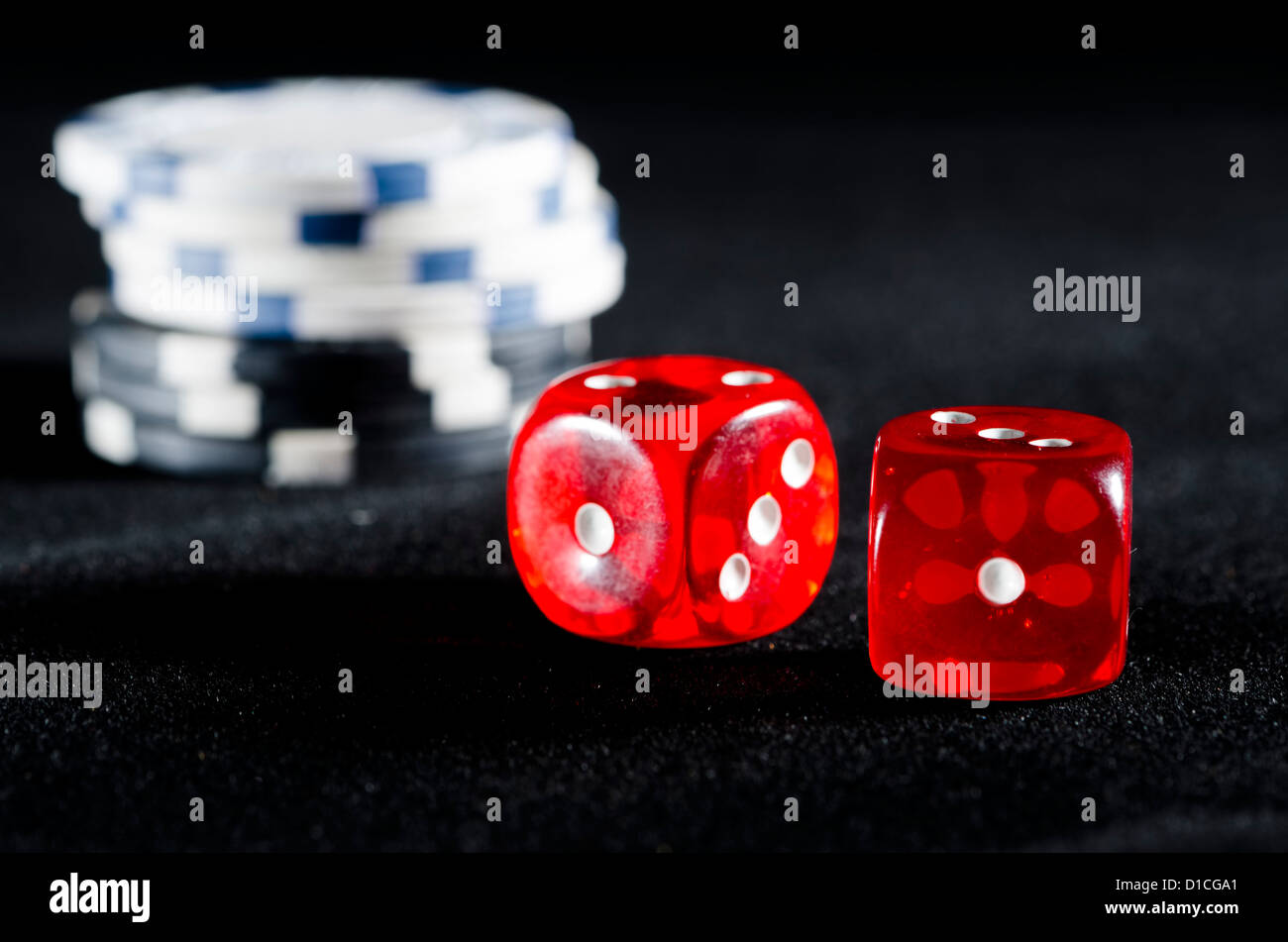 Rolling winning dice at casino Stock Photo - Alamy