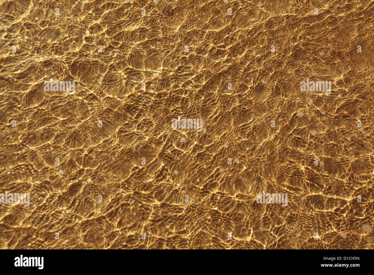 Wave and water shapes on a beach shoreline Stock Photo - Alamy