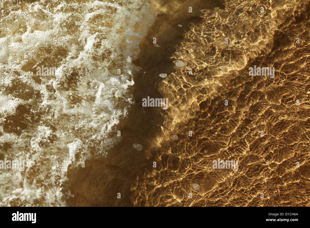 Wave and water shapes on a beach shoreline Stock Photo - Alamy