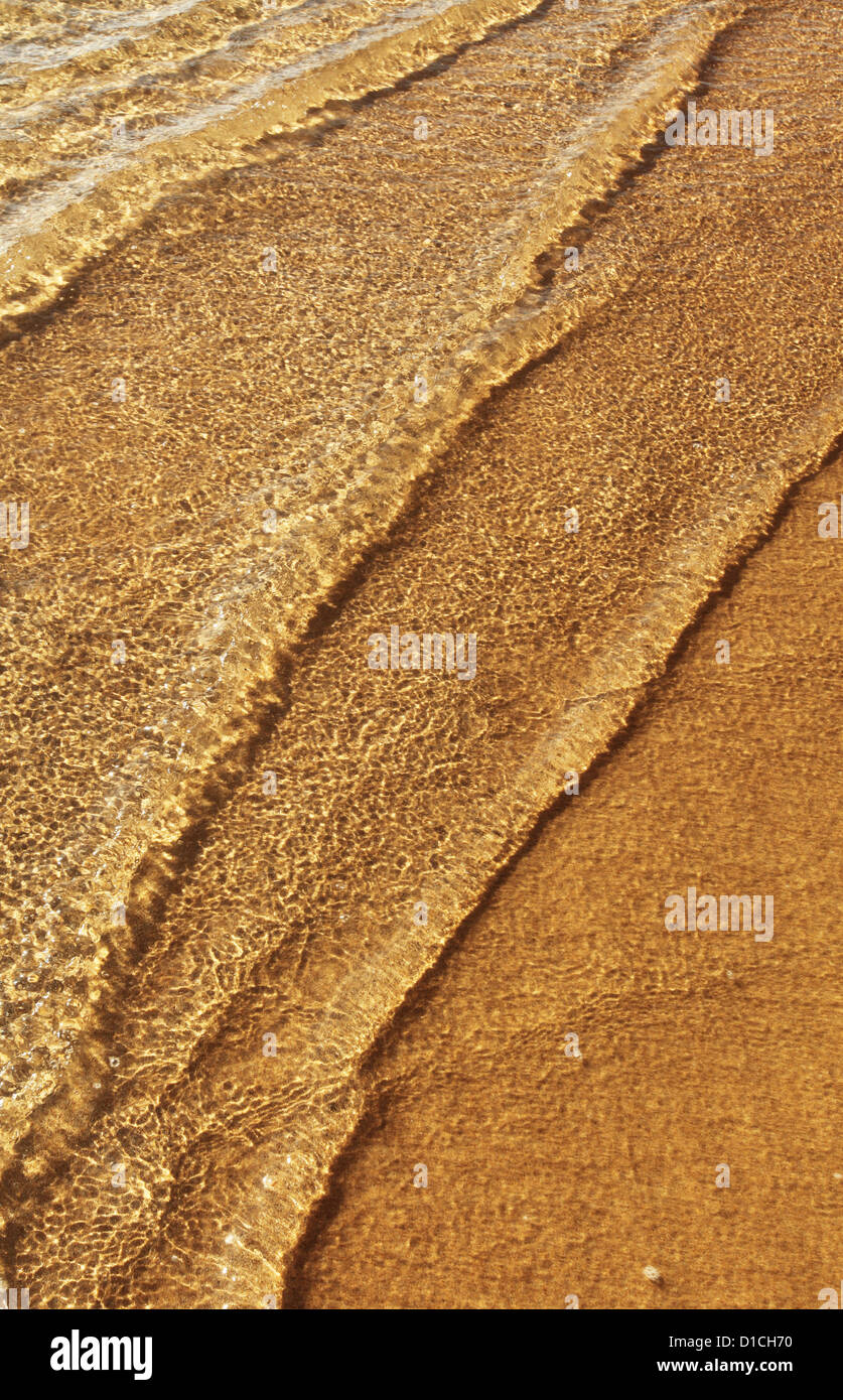 Wave and water shapes on a beach shoreline Stock Photo - Alamy