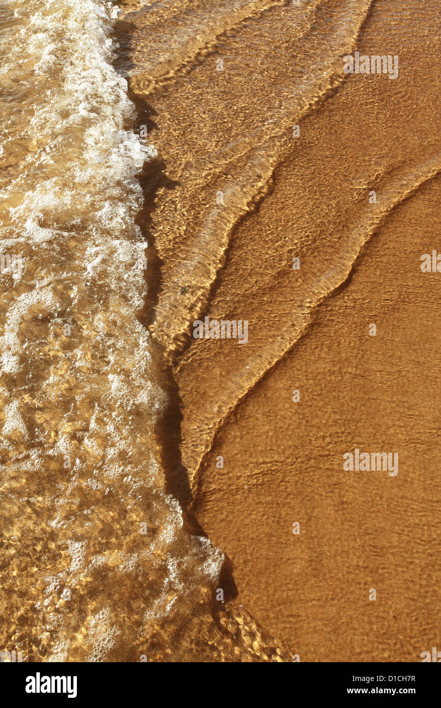 Wave and water shapes on a beach shoreline Stock Photo - Alamy