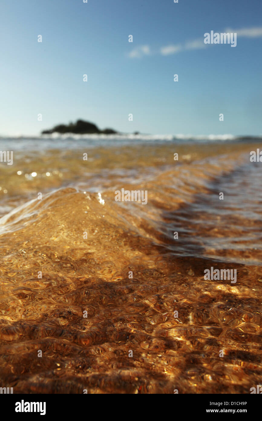 Wave and water shapes on a beach shoreline Stock Photo - Alamy