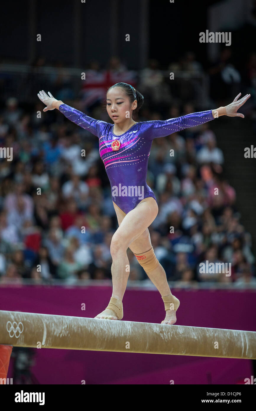 Linlin Deng (CHN) competing on the balance beam during the Women's ...