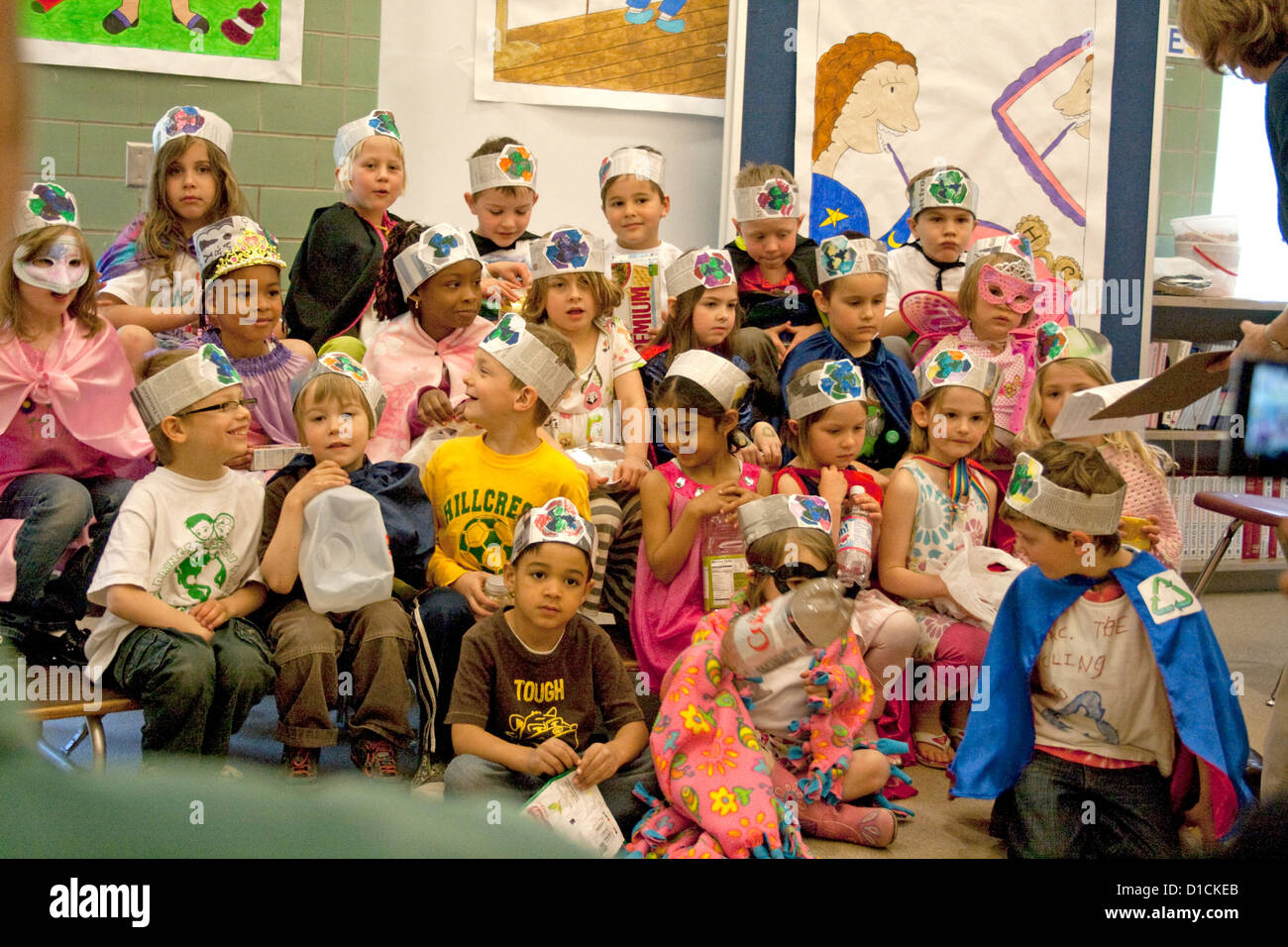 Classroom of racially mixed first grade children presenting a program ...