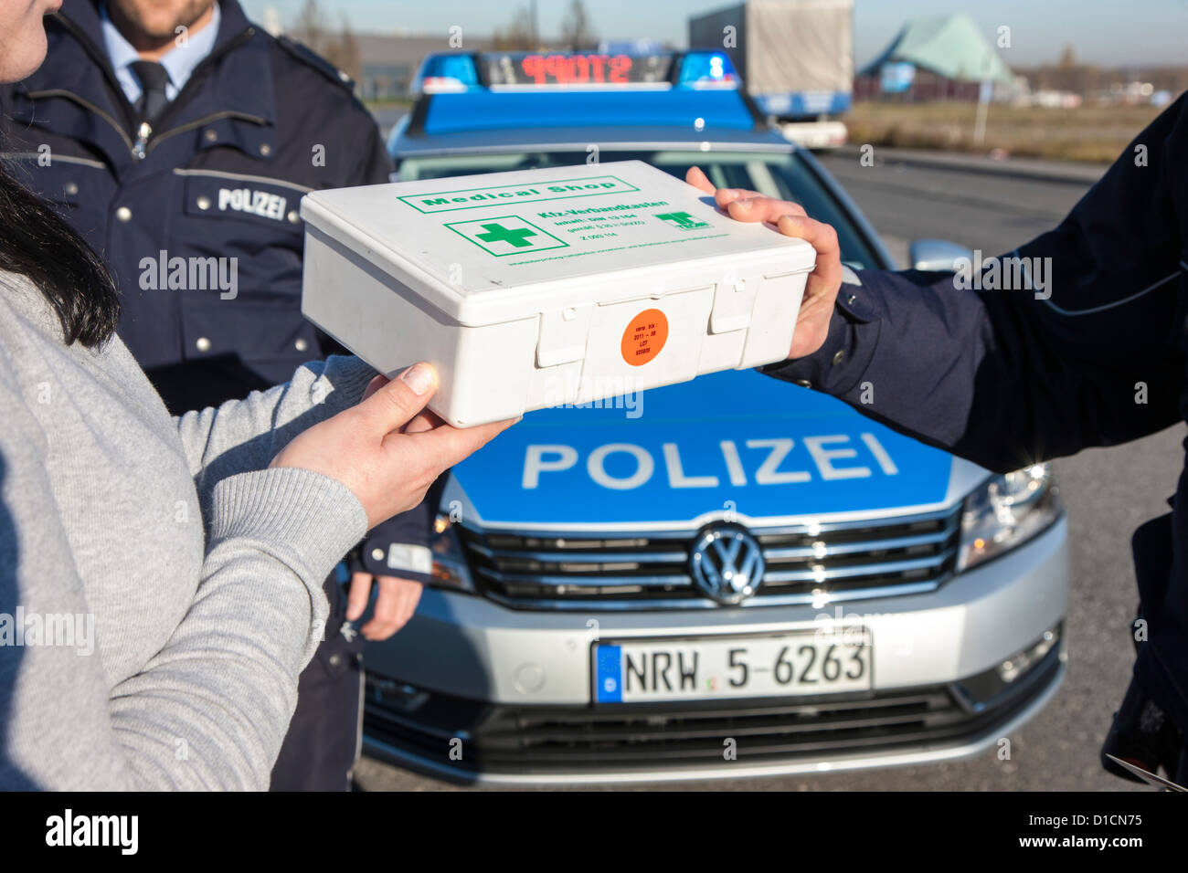 Police control. Checking the first aid box of a driver Stock Photo - Alamy