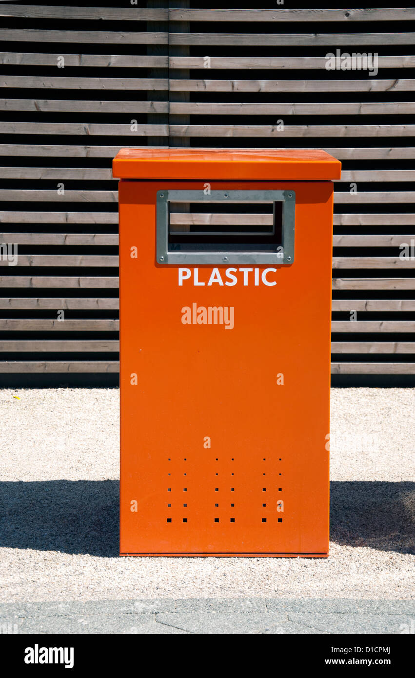 Orange trash can for recycling plastic Stock Photo - Alamy