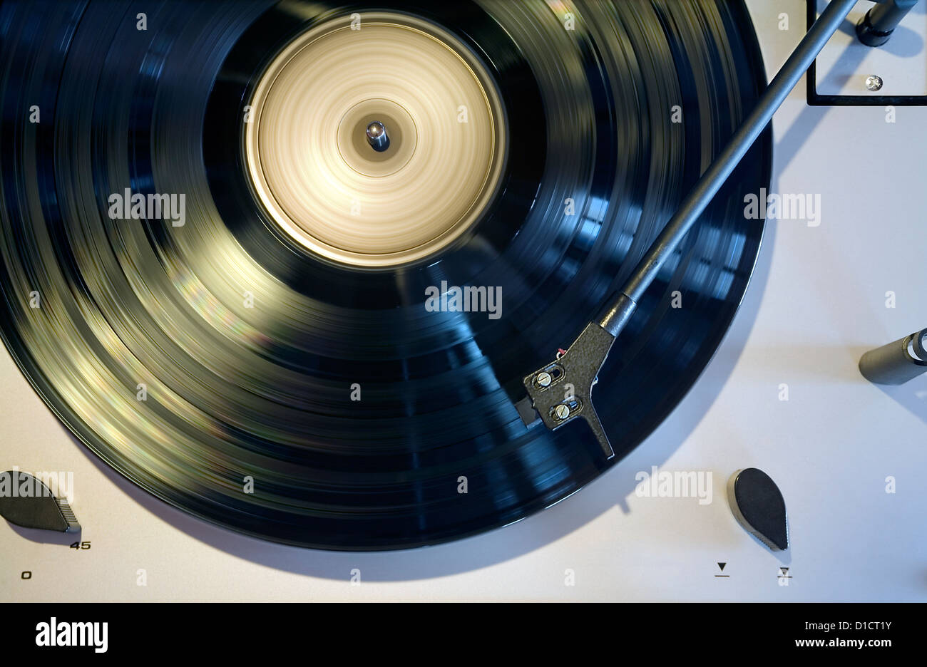 Turntable with an LP record in rotation blur Stock Photo - Alamy