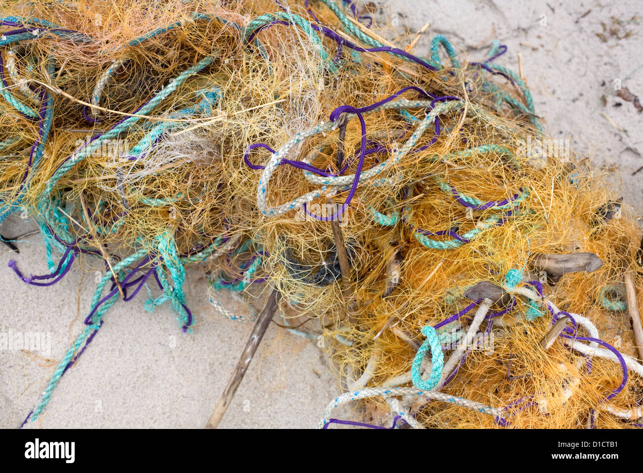 Tangled Fishing Net Washed Up On Beach Stock Photo - Alamy