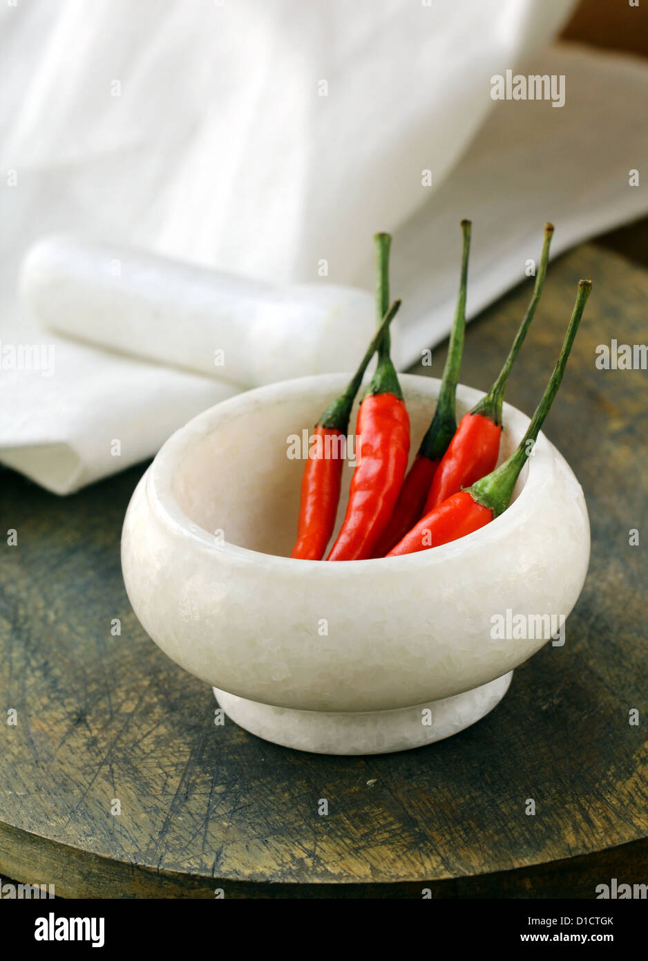 red hot chili peppers in a marble mortar Stock Photo - Alamy