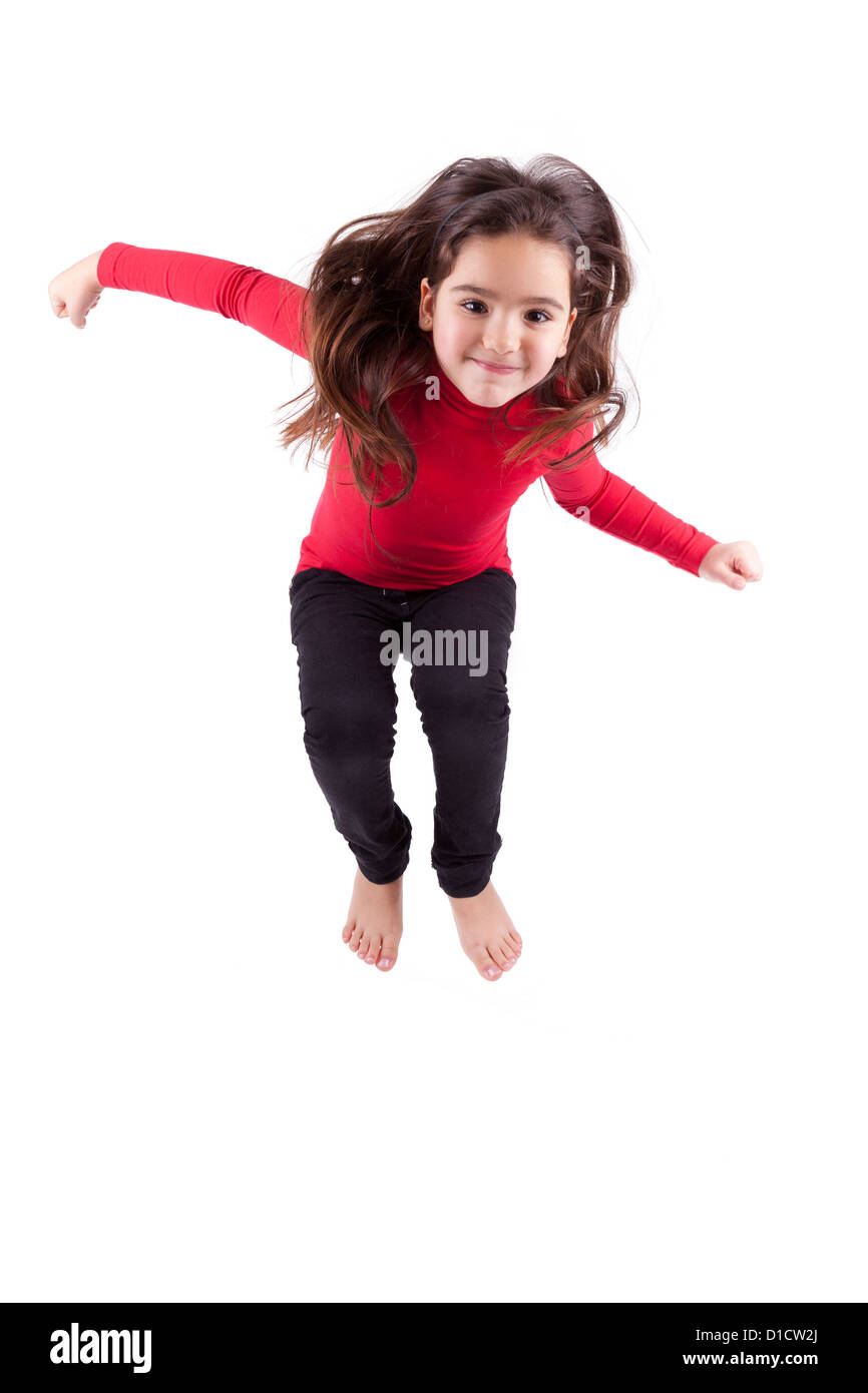 Portrait of cute Young caucasian little girl jumping, over white ...