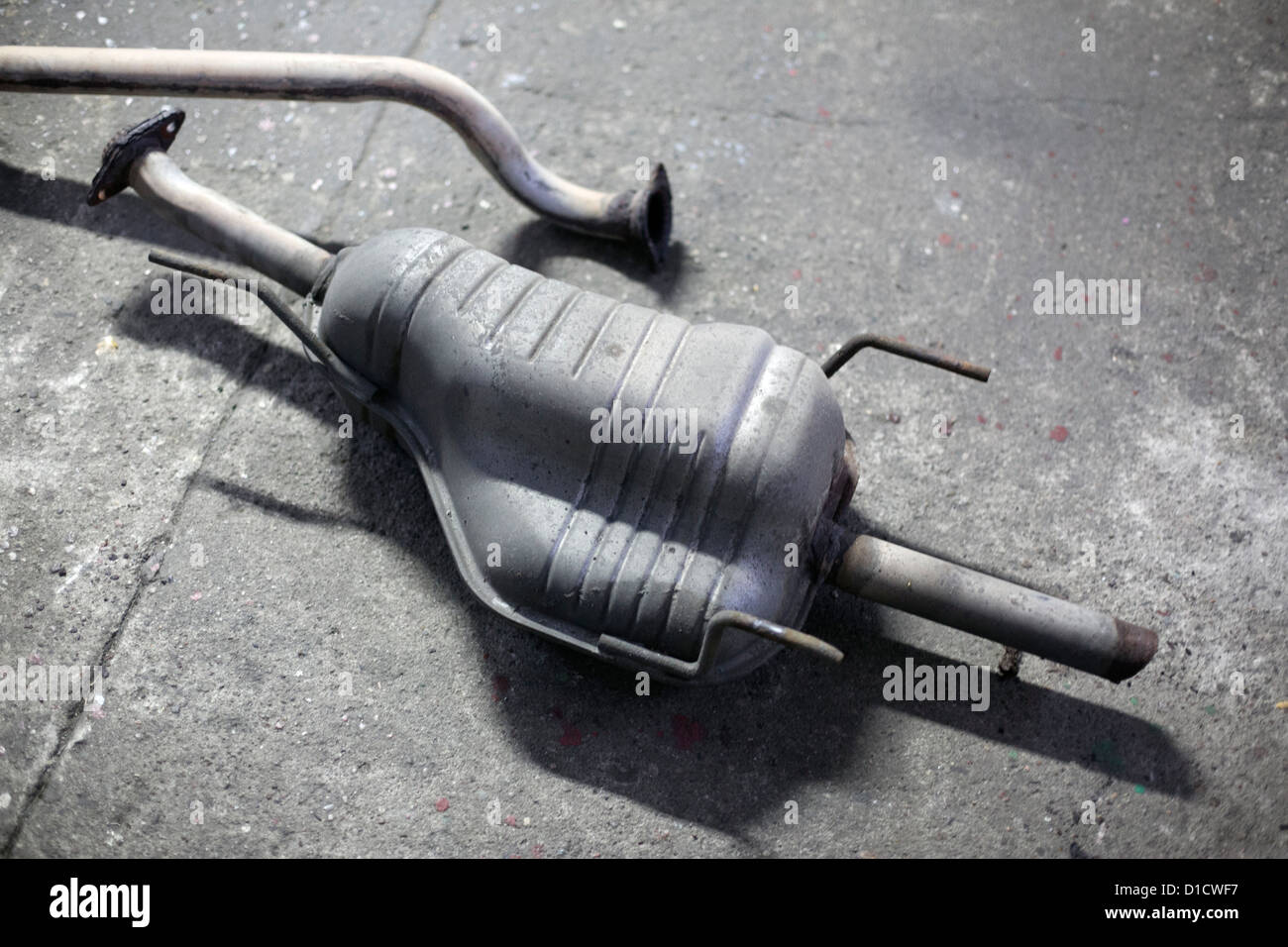 Old Car Exhaust on Floor Stock Photo - Alamy