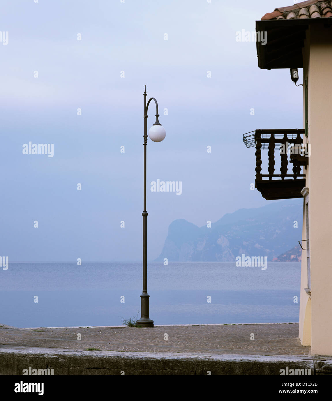 Torbole, Italy, lantern and old customs house with a balcony on the ...