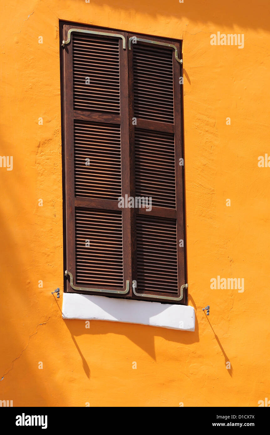 Window of a house closed with shutters Stock Photo - Alamy
