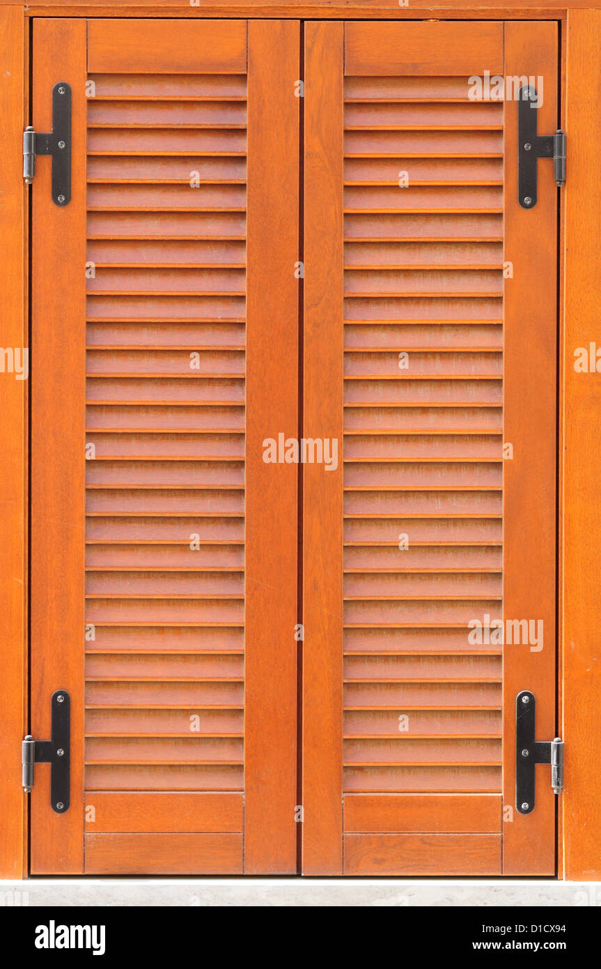 Window closed with wooden shutters Stock Photo - Alamy