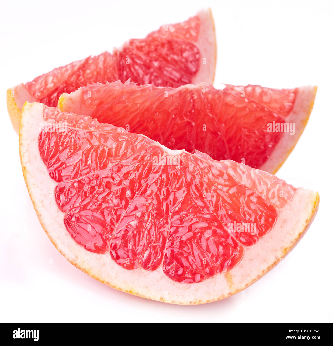Slices of grapefruit on a white background Stock Photo - Alamy