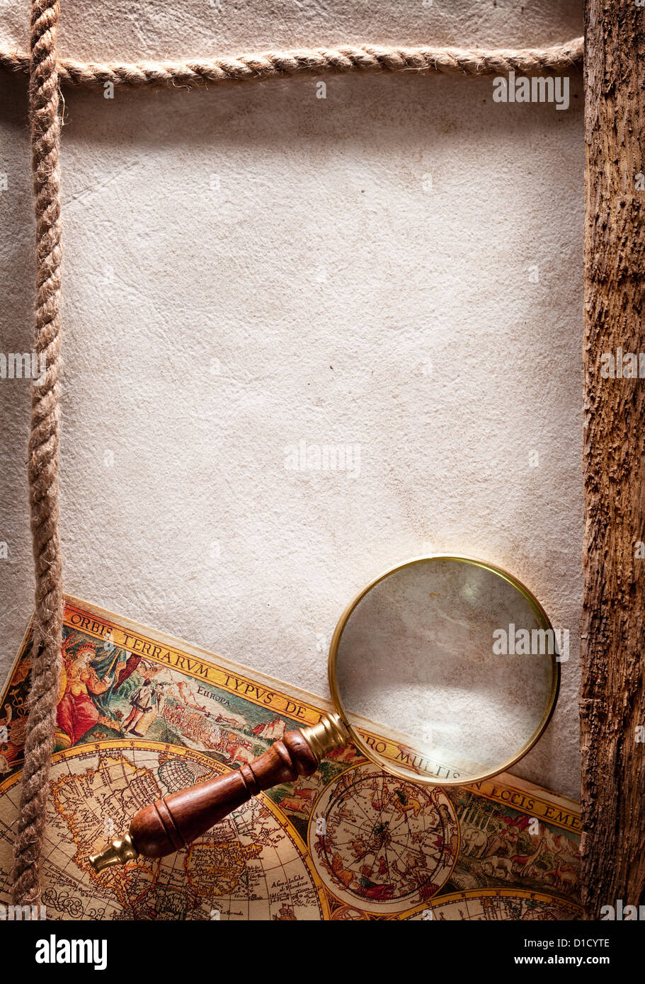 Magnifying glass on old parchment Stock Photo - Alamy