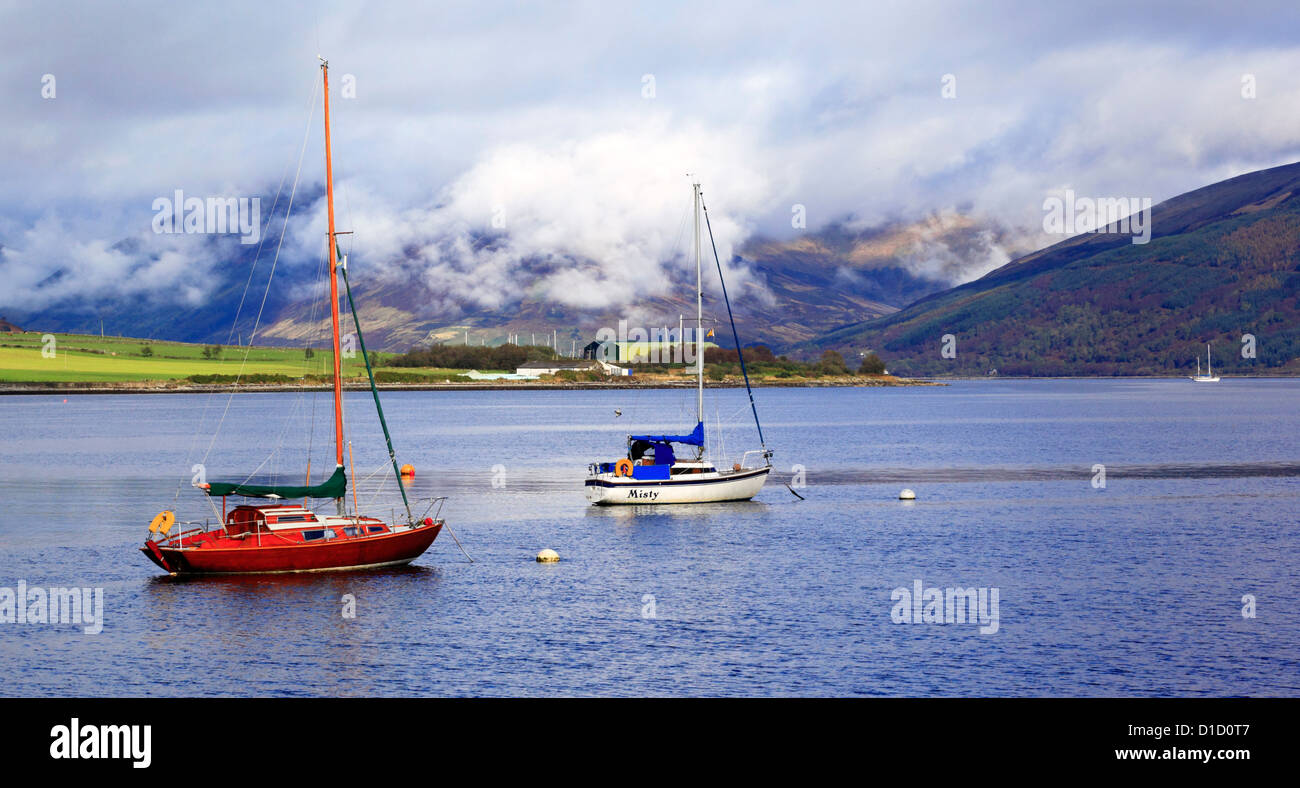 Kames Bay at Port Bannatyne with a cloud covered peak across the sea in ...