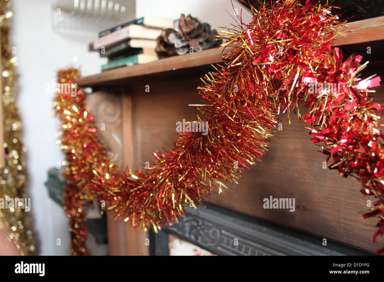 A fireplace decorated with tinsel Stock Photo - Alamy