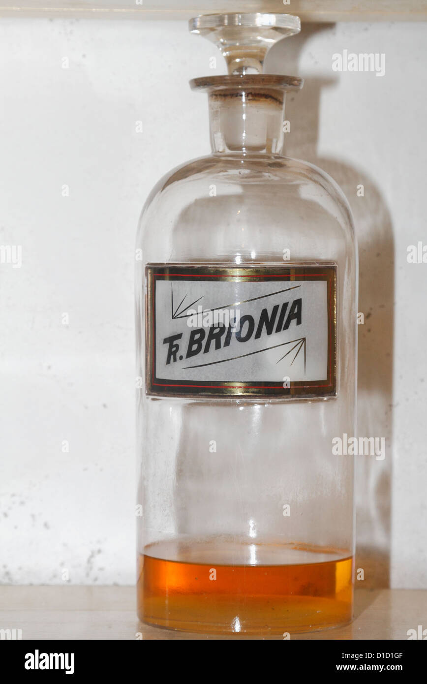 Vintage medical pharmaceutical colorful chemical bottles on the shelf ...