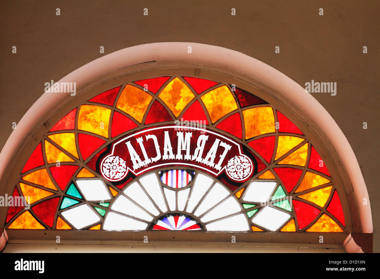 Colorful stained glass (glassware) sign on the top of entrance door of ...