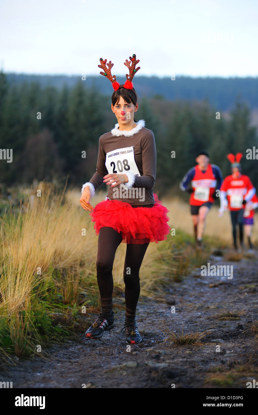 competitor in a christmas ' turkey trot ' trail race dressed as a ...