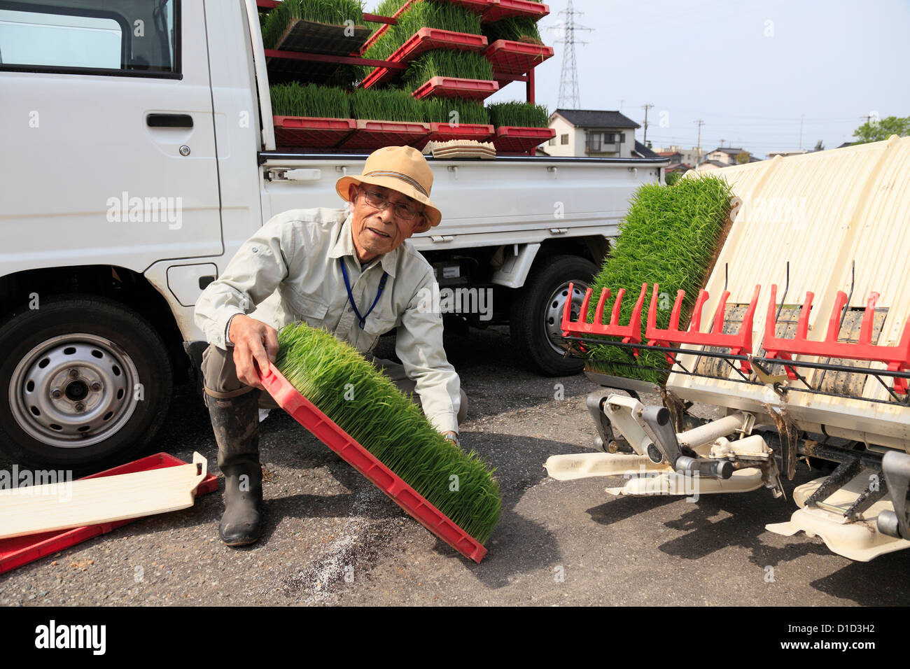 Farmer Setting Up Rice Planter Stock Photo - Alamy