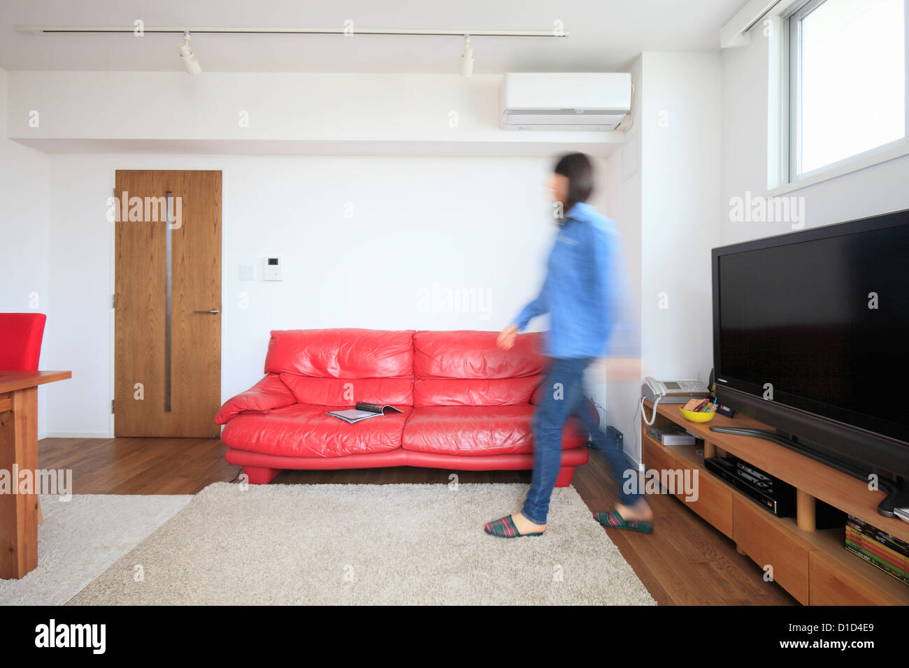 Young Woman Walking Living Room Stock Photo - Alamy