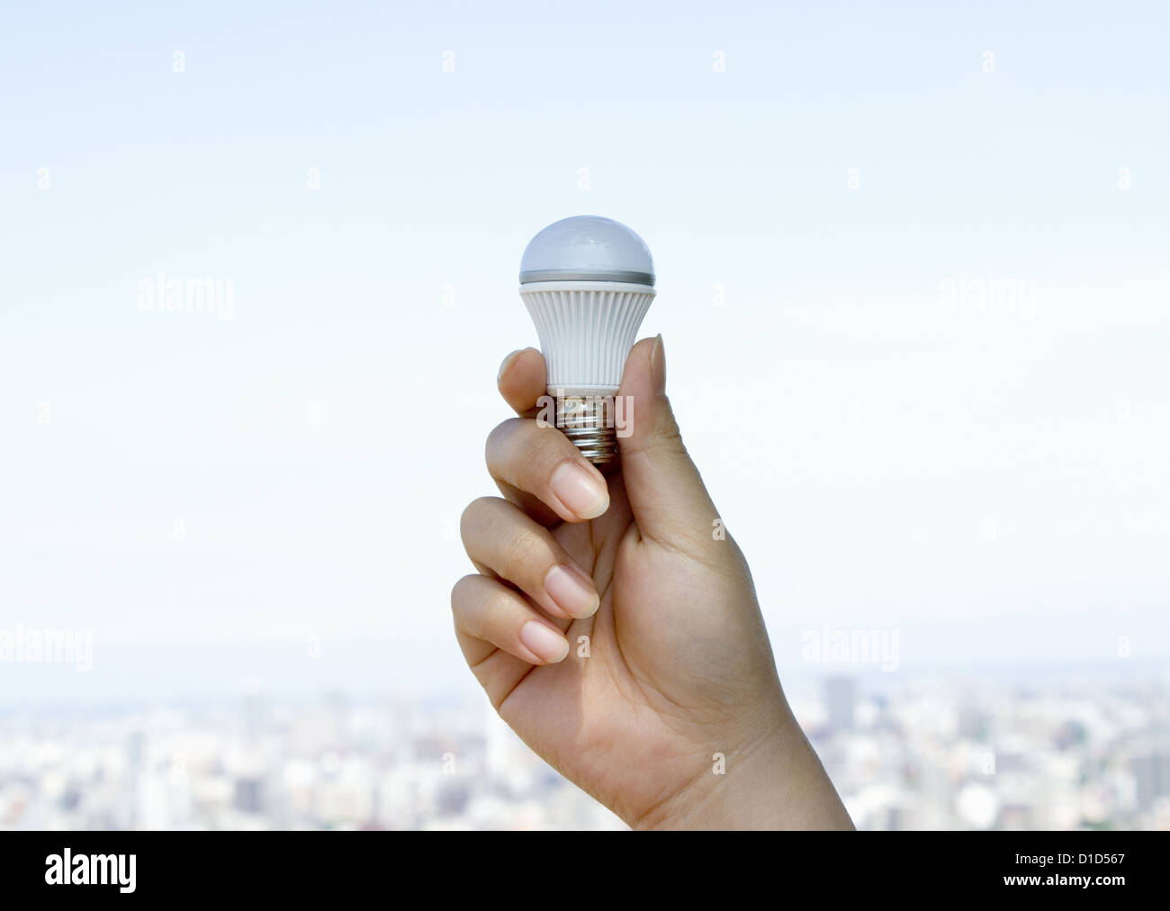 Hand holding a LED bulb Stock Photo - Alamy