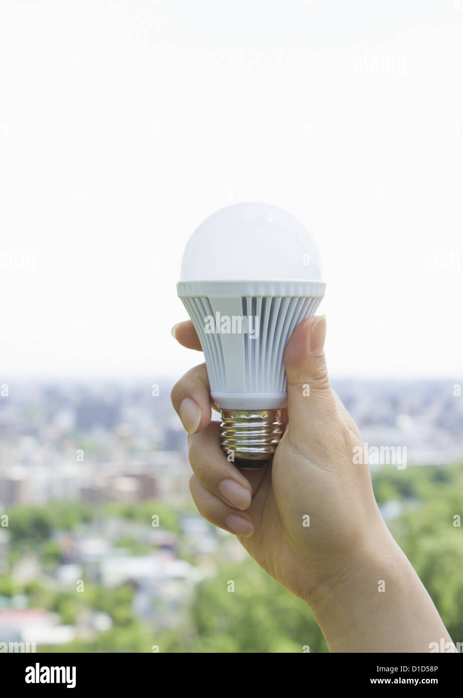 Hand holding a LED bulb Stock Photo - Alamy