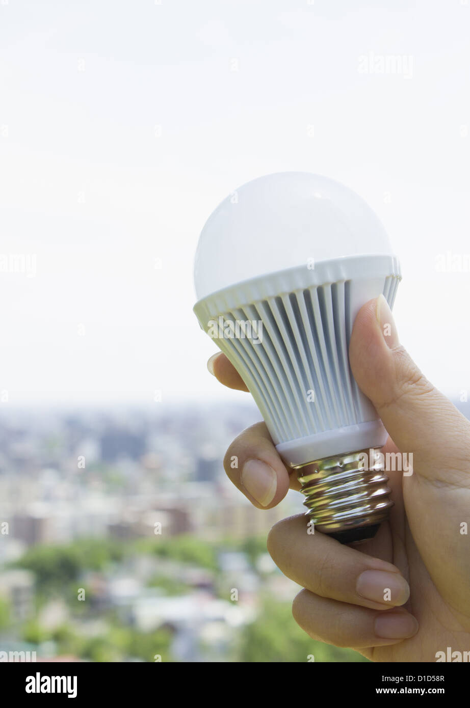 Hand holding a LED bulb Stock Photo - Alamy