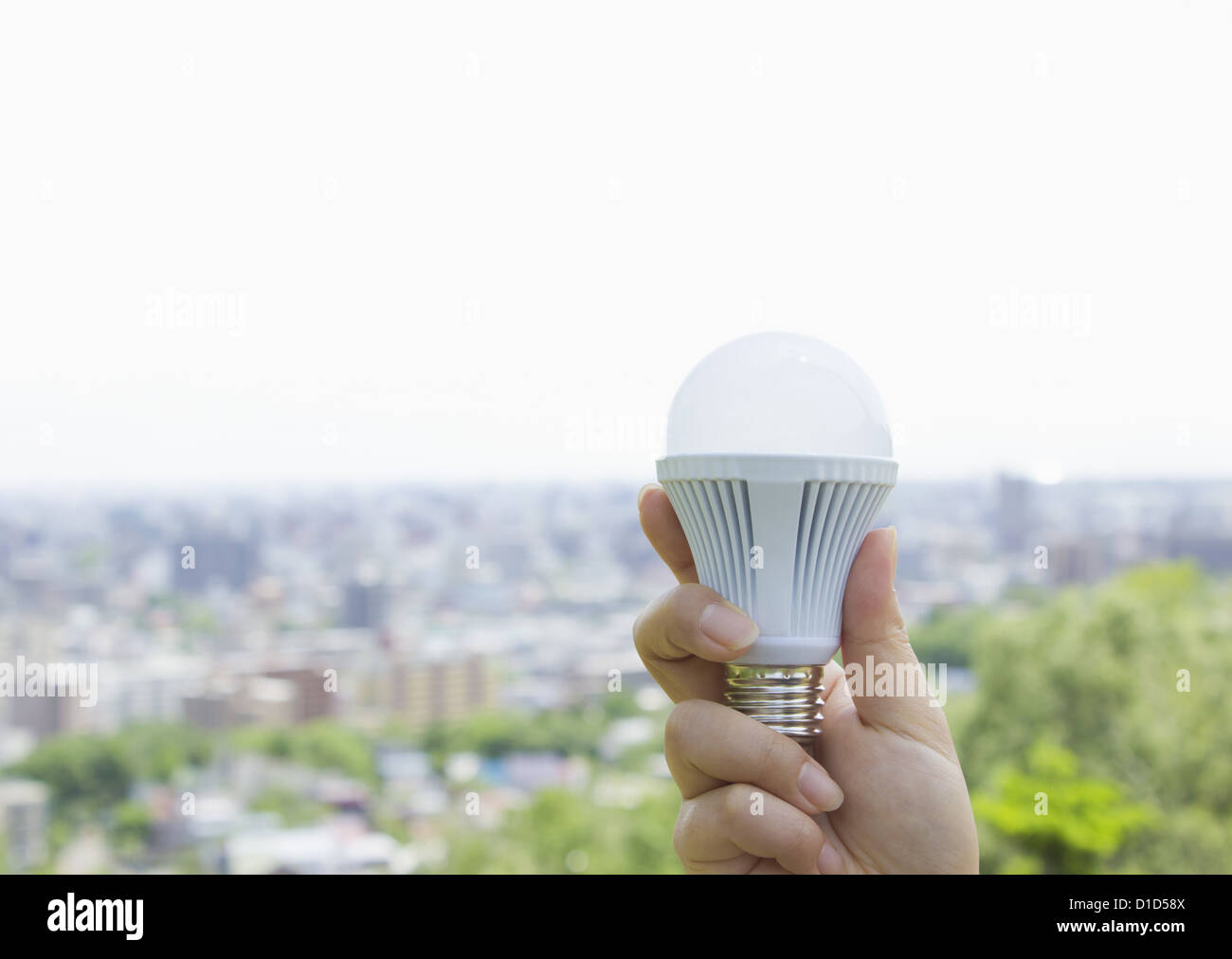 Hand holding a LED bulb Stock Photo - Alamy