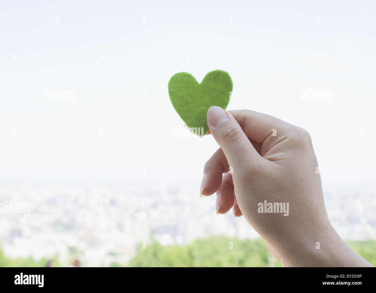 Hand holding a heart Stock Photo - Alamy